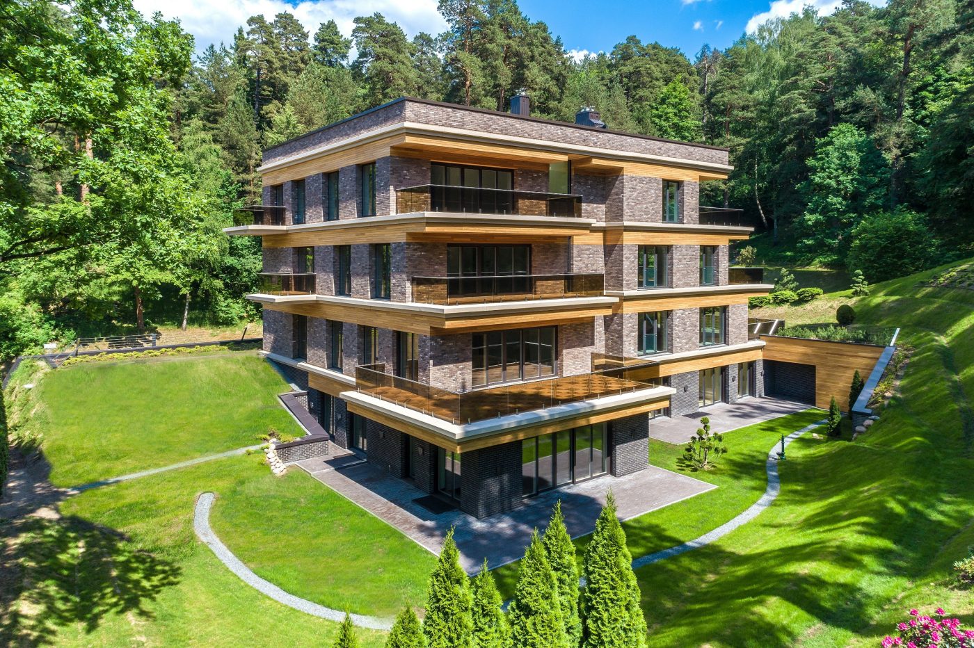 Split-level house surrounded by pines
